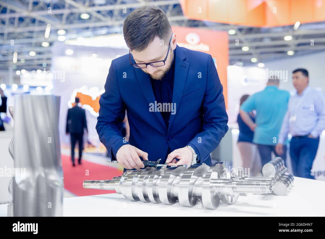 Engineer checks dimensions with vernier caliper at finish detail after ...