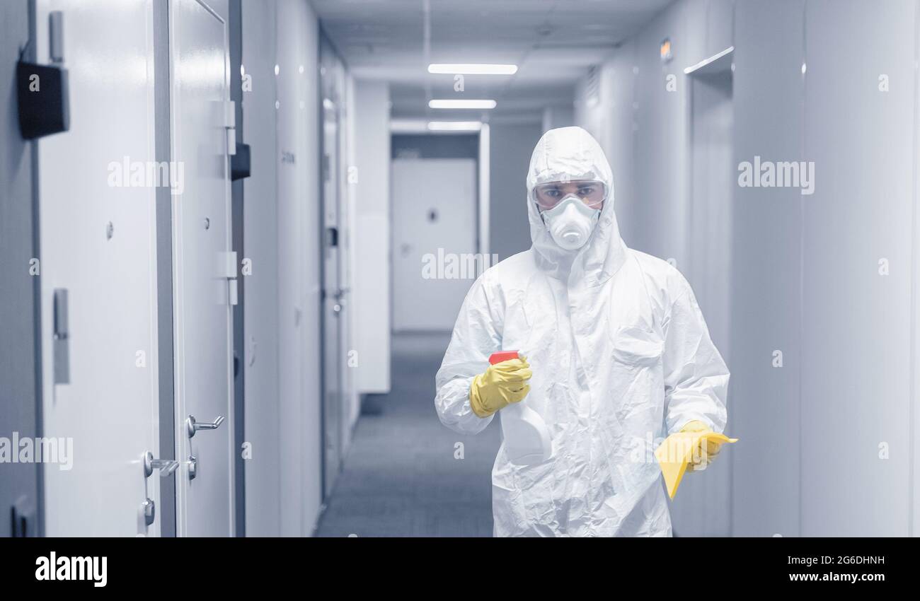 Disinfect worker in biohazard sanitize and clean home apartment vs ...