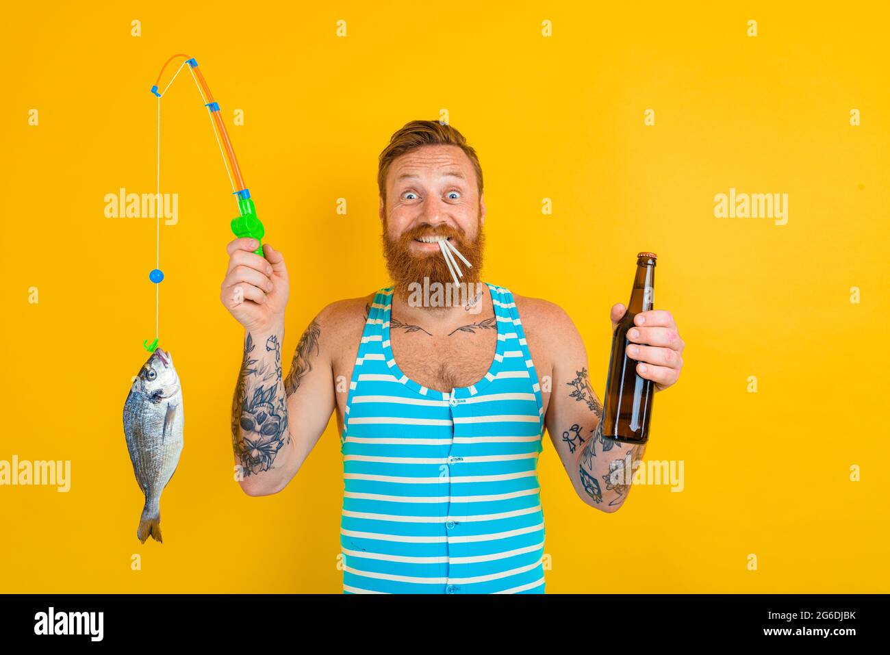 man with beard and swimsuit caught a fish Stock Photo - Alamy