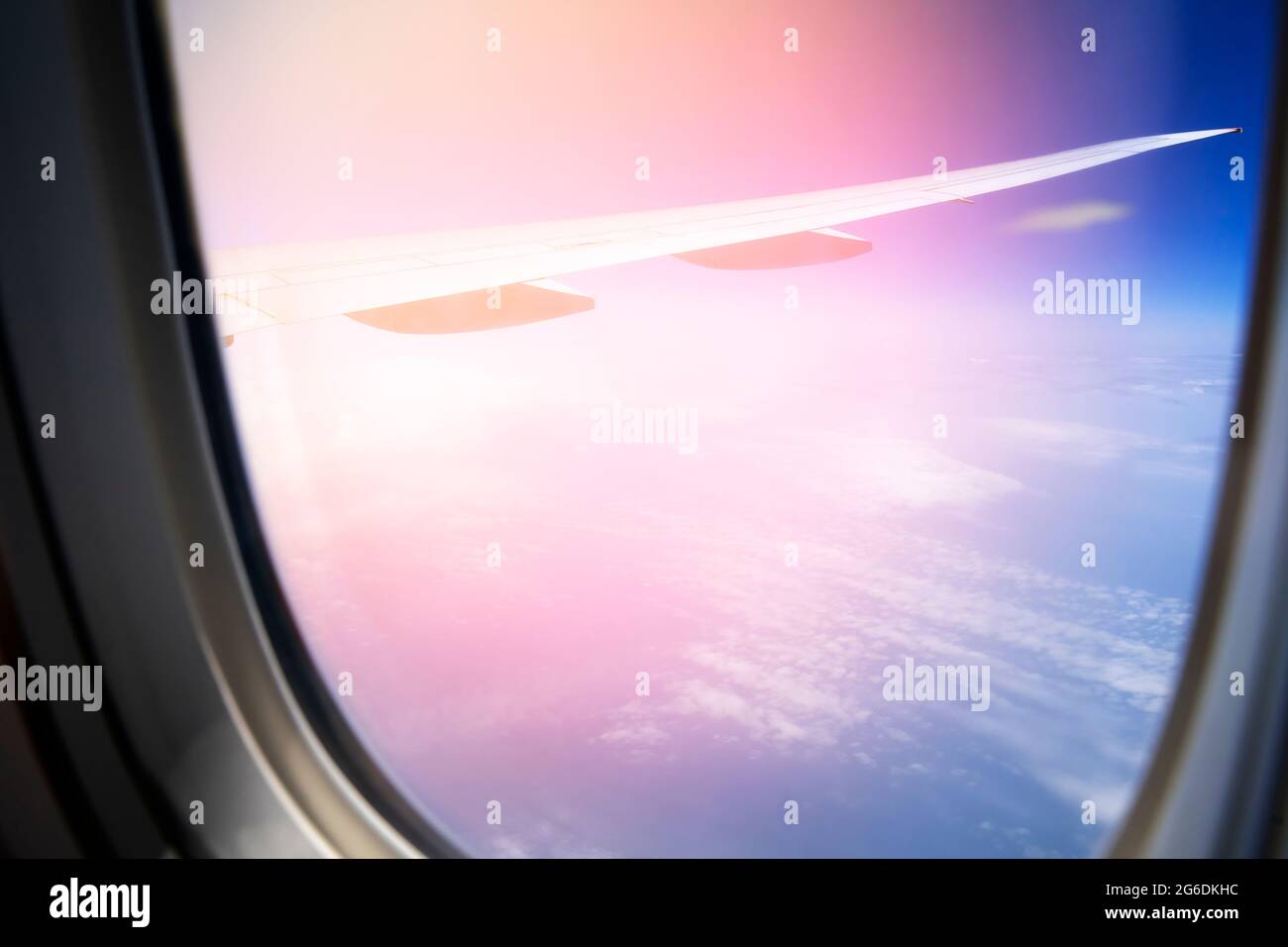 Beautiful aerial view seen through window of flying aeroplane. Sun ...