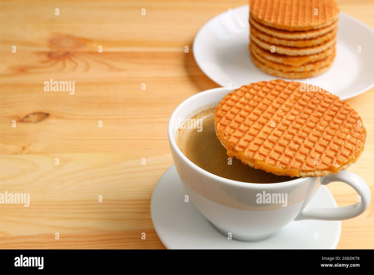 Hot Coffee with Stroopwafel Placed on Top of the Cup with Blurry ...