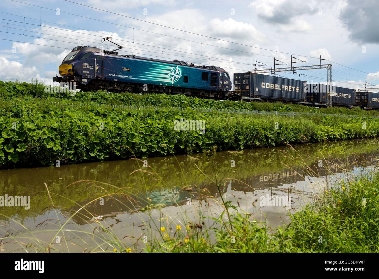 A class 88 locomotive pulling a freightliner train alongside the Oxford ...