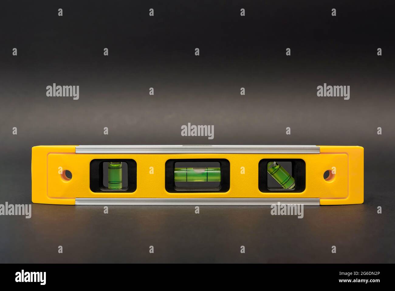Building level in yellow on a black background. Construction tool ...