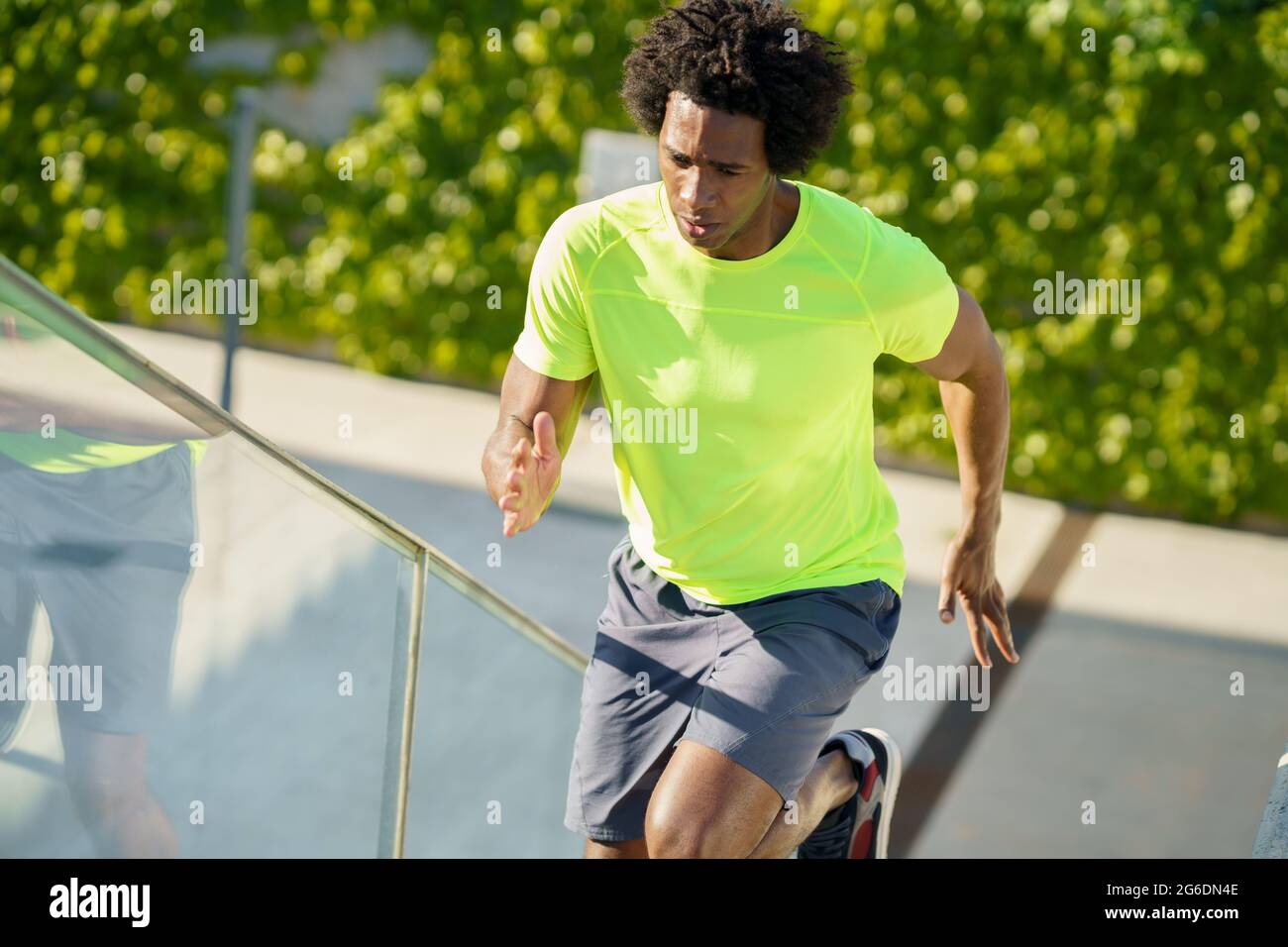 Black male running hi-res stock photography and images - Alamy
