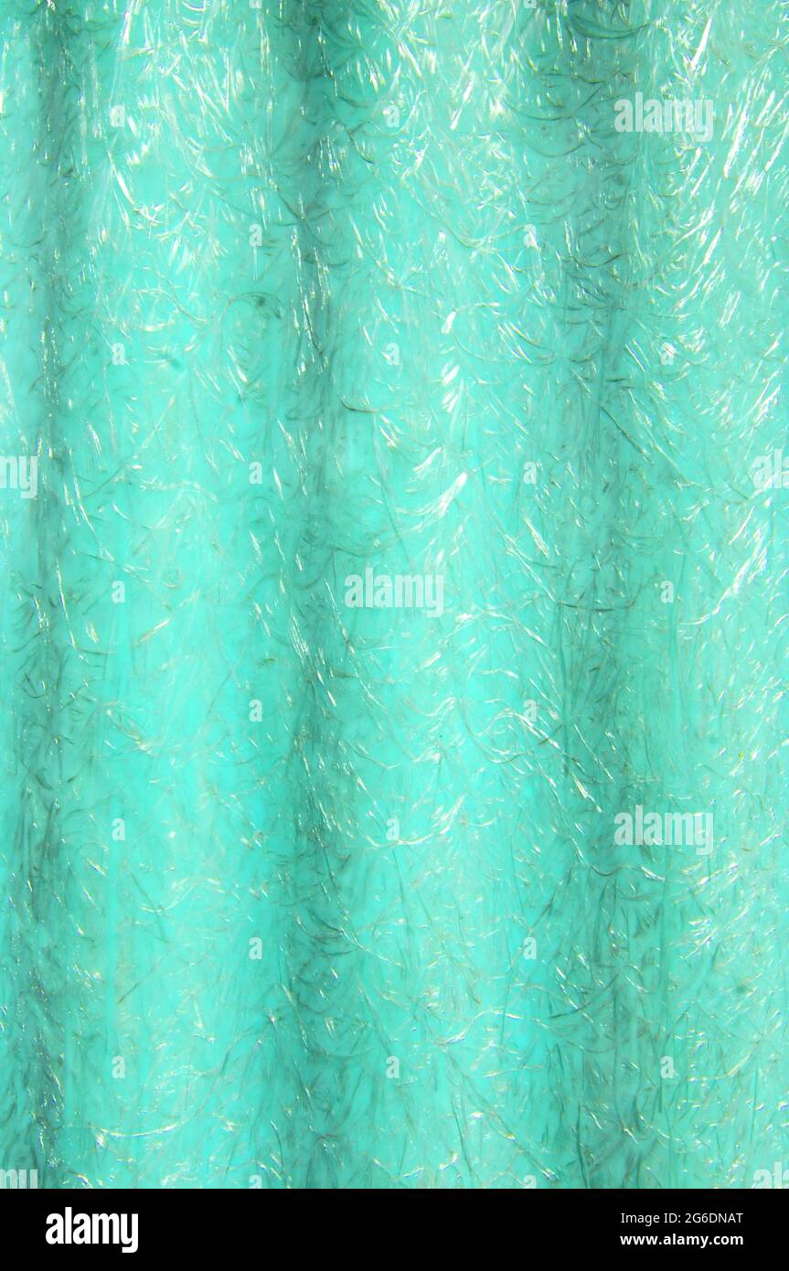 Large sheet of aqua fibreglass is molded into ridges and swells Stock ...