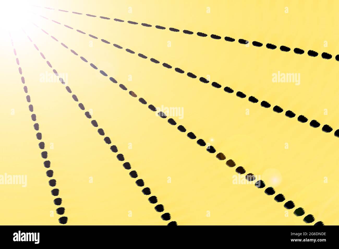 Painted dashes follow the suns rays at it glows across image. Yellow ...