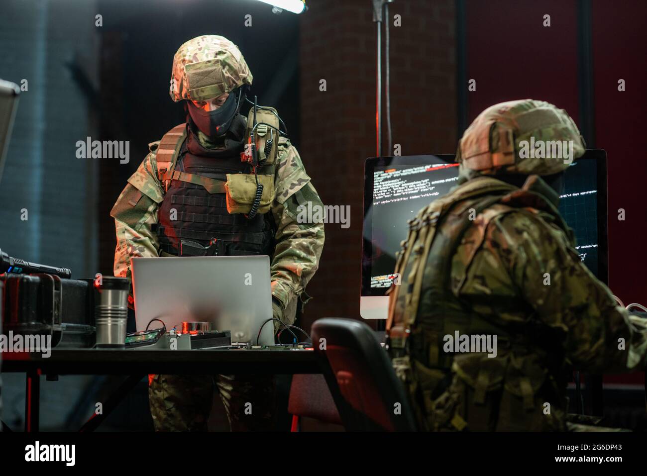 Network criminals in camouflage attire stealing secret information ...