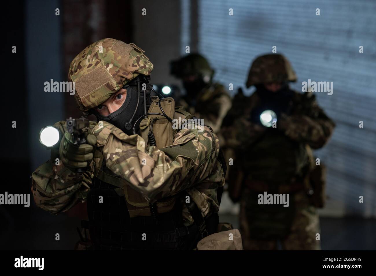Terrorists with guns penetrating into office at night Stock Photo - Alamy