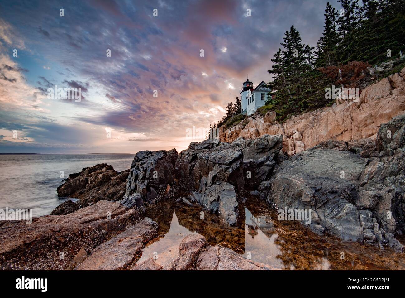 A lighthouse at sunrise Stock Photo - Alamy