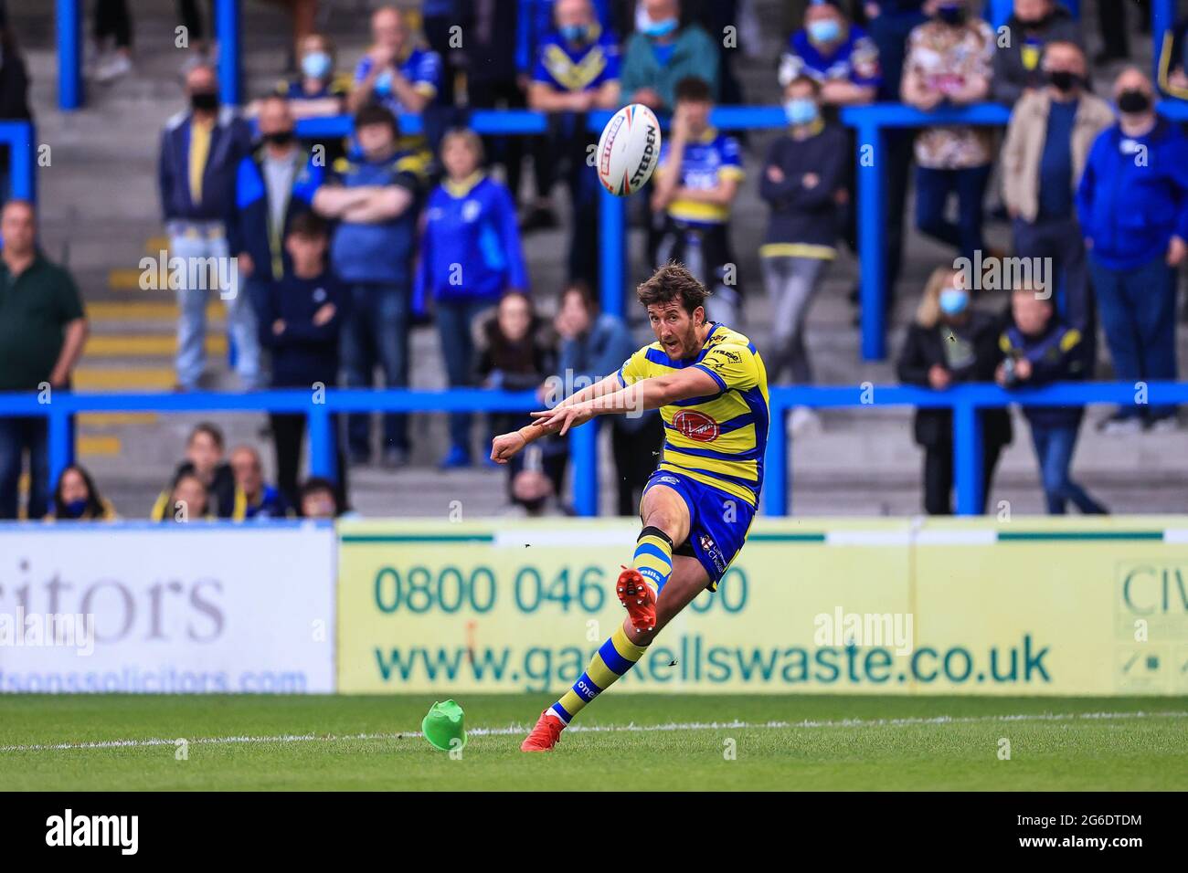 Stefan Ratchford (1) of Warrington Wolves attempt to kick the ...