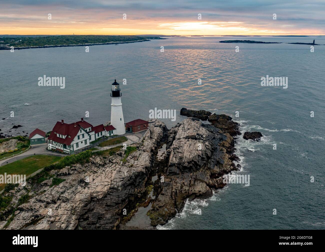 A lighthouse at sunrise Stock Photo - Alamy