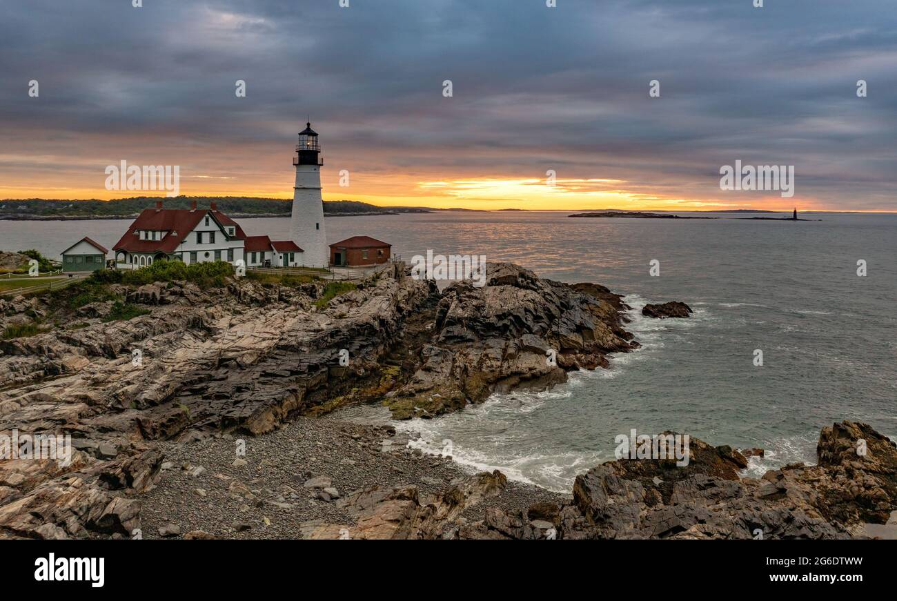 A lighthouse at sunrise Stock Photo - Alamy