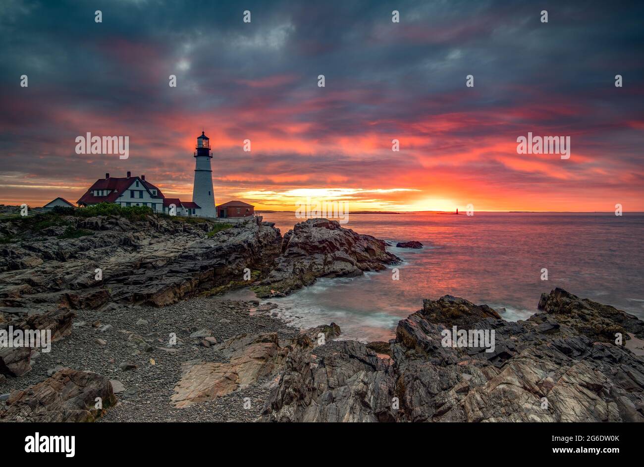 A lighthouse at sunrise Stock Photo - Alamy