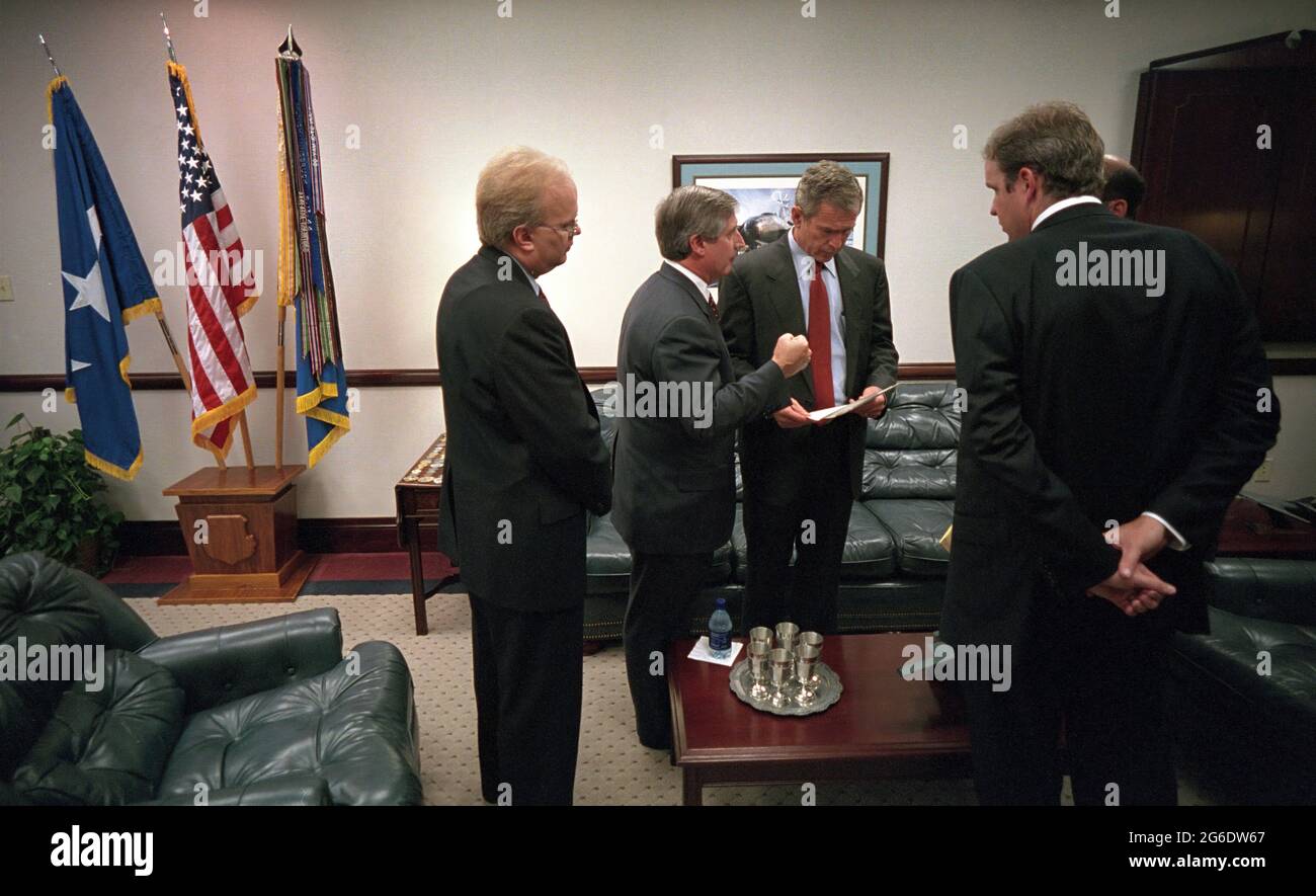 President George W. Bush confers with, from left, Karl Rove, Andy Card ...