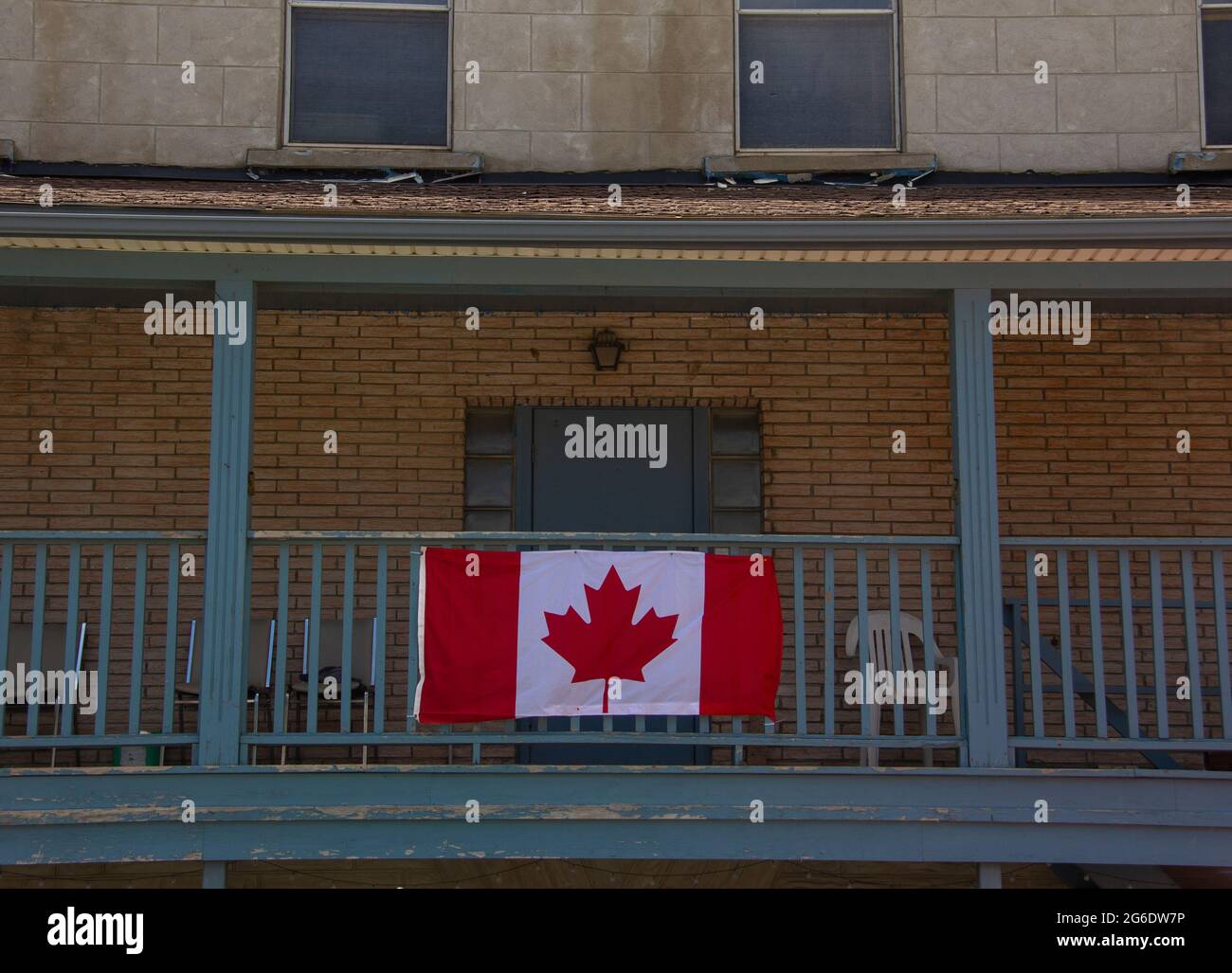 Canadian flag on a balcony railing Stock Photo - Alamy