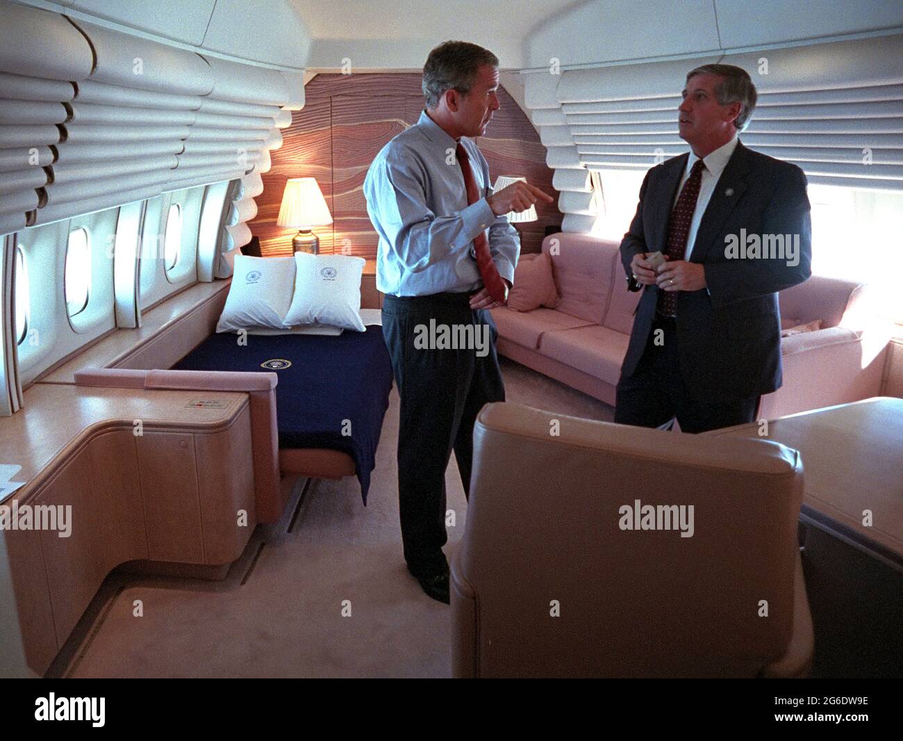 President George W. Bush confers with White House Chief of Staff Andy ...