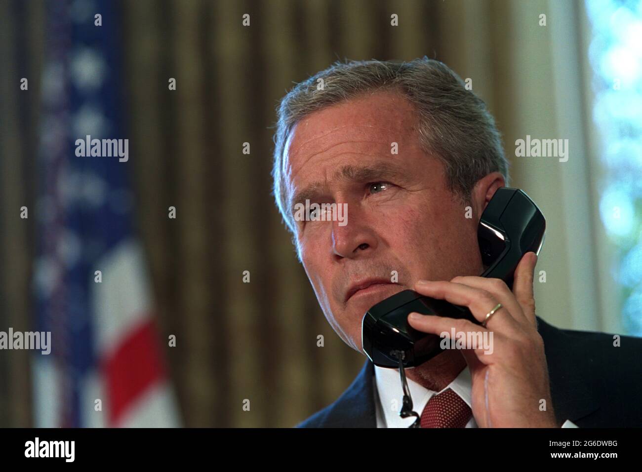 Pledging his support, President George W. Bush talks via telephone ...