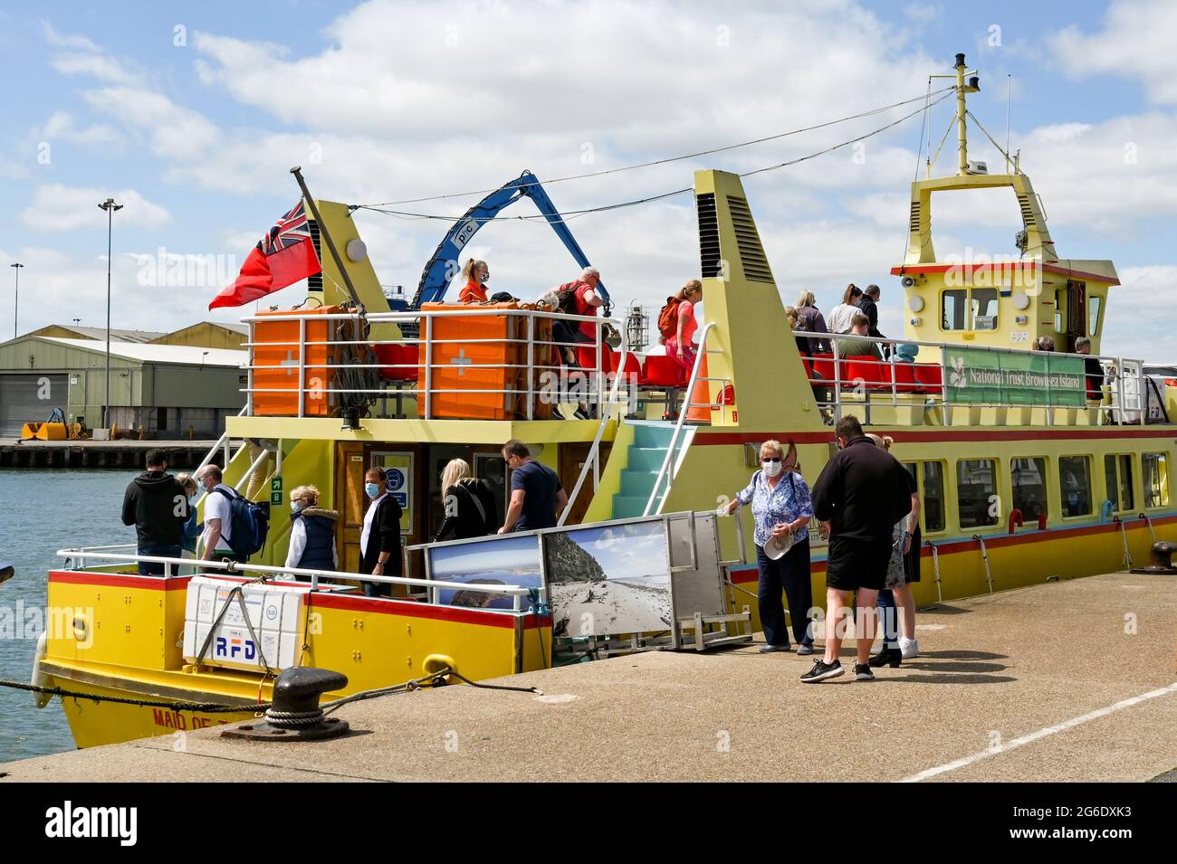 Poole, England - June 2021: Visitors to the town boarding a sightseeing ...