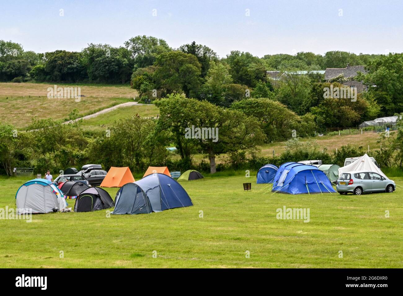 Dorset, England - June 2021: Tents set up on a camping site on the ...
