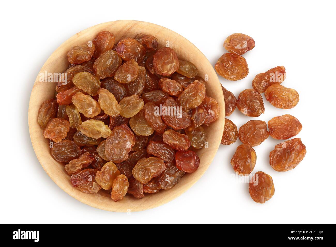 Brown raisins in wooden bowl isolated on white background with clipping ...