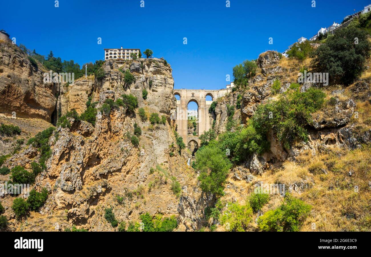 Beautiful view of historic roman bridge connecting two parts of Ronda ...