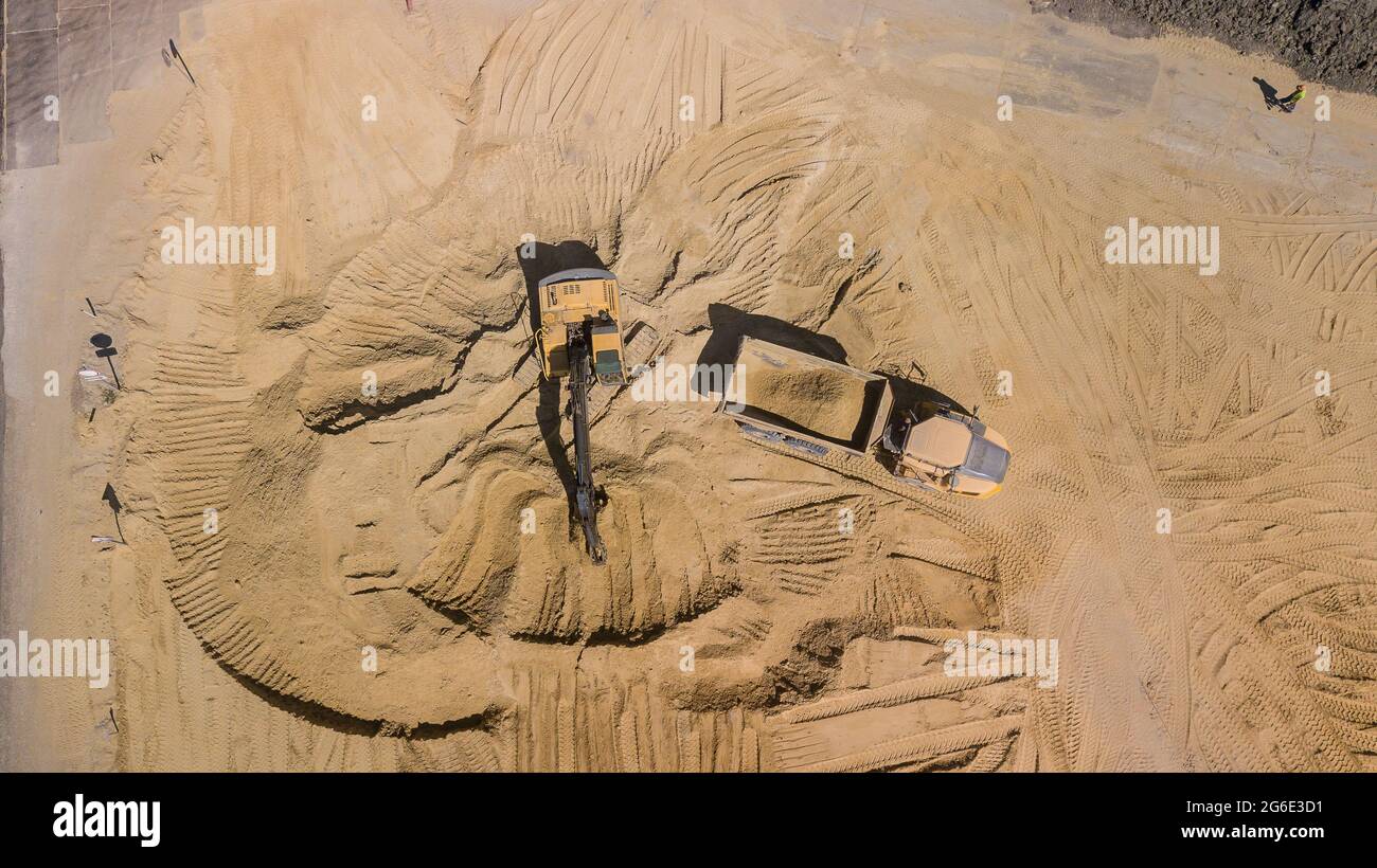Directly above view of construction machinery in working Stock Photo ...