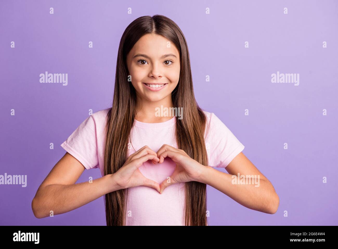 Photo of young girl happy positive smile show fingers heart sign ...