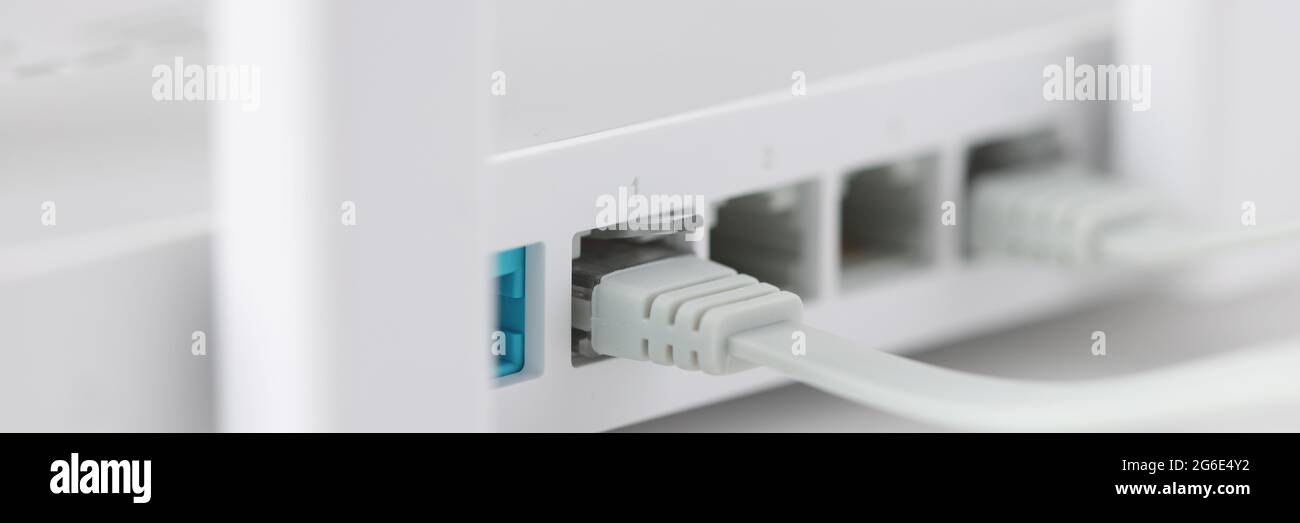 Network cable is plugged into socket of access point closeup Stock ...