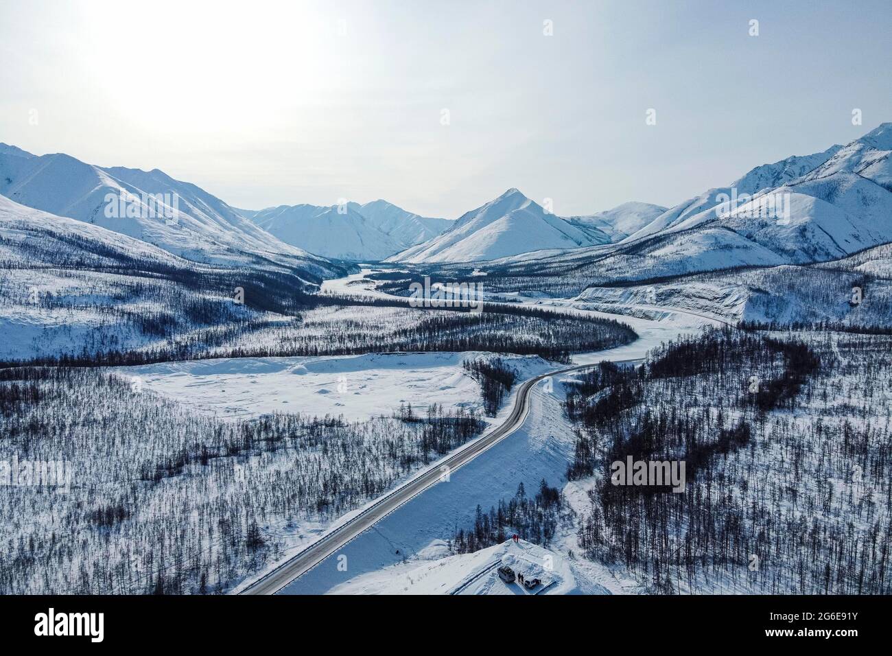 Aerial of the snow covered Suntar-Khayata mountain Range, Road of Bones ...