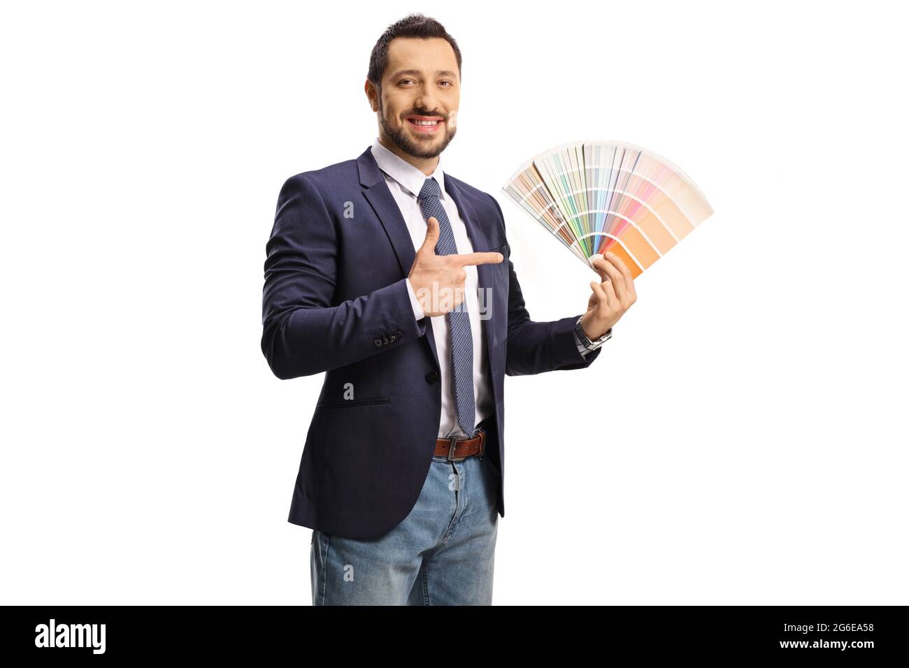 Man holding a color palette and pointing isolated on white background ...