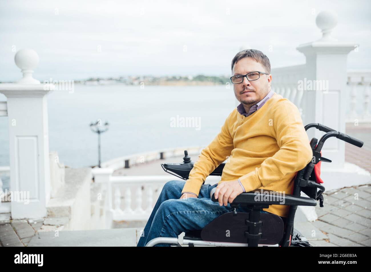 portrait of a man with a disability in a wheelchair Stock Photo - Alamy