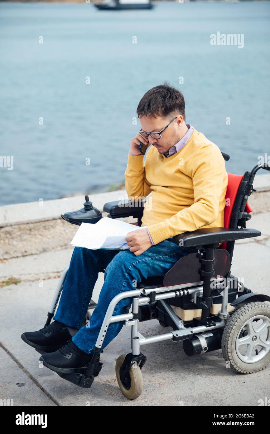 man with disabilities in wheelchair job business community Stock Photo ...