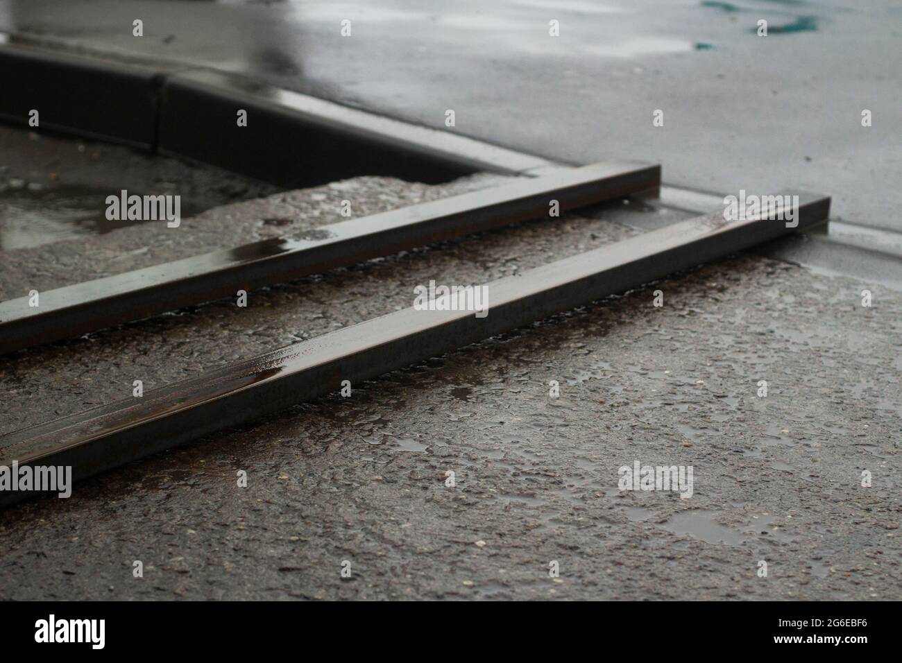Steel beams rust in the rain. Metal parts on the street Stock Photo - Alamy