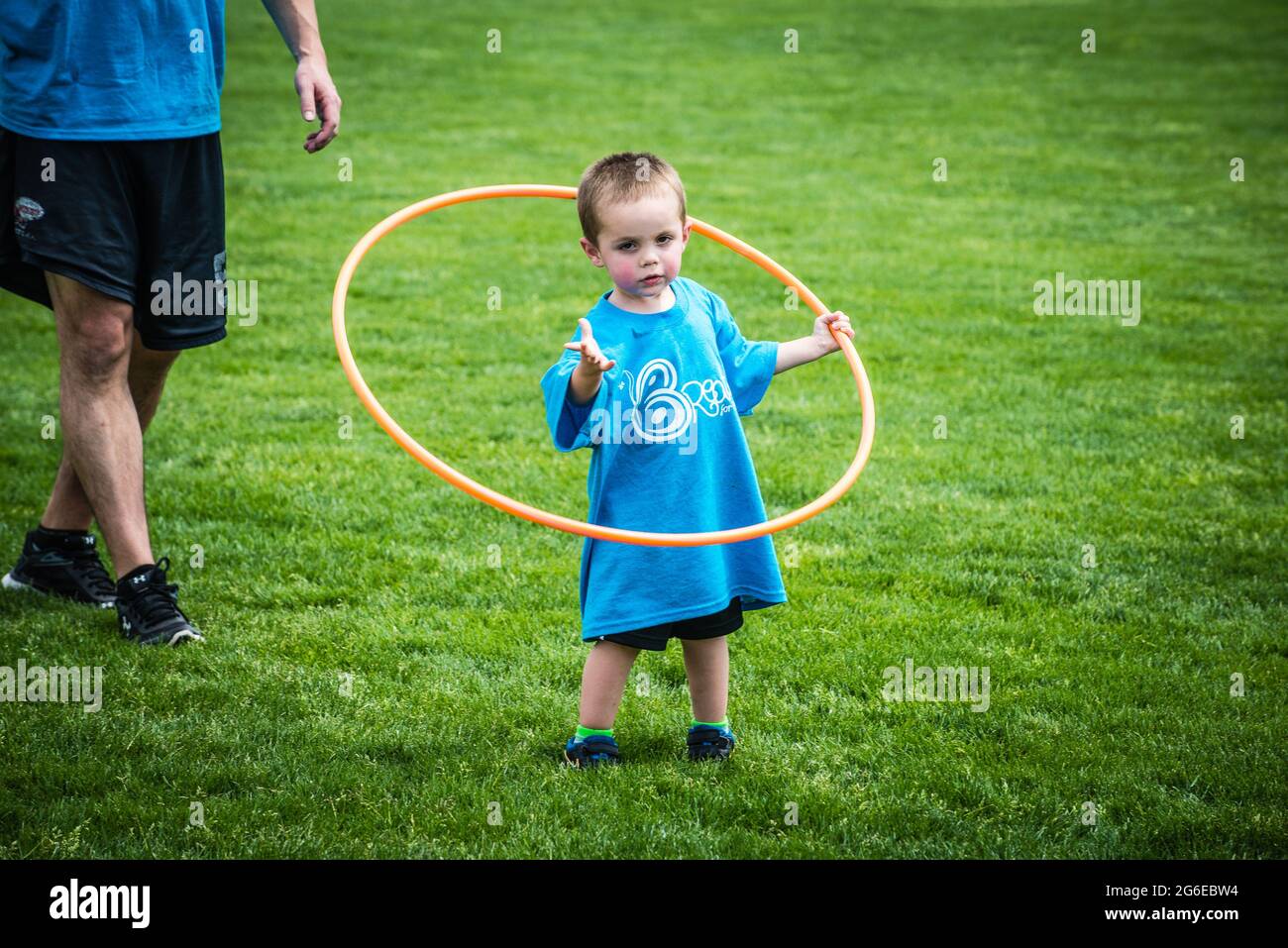 Young boy with hula hoop Stock Photo - Alamy