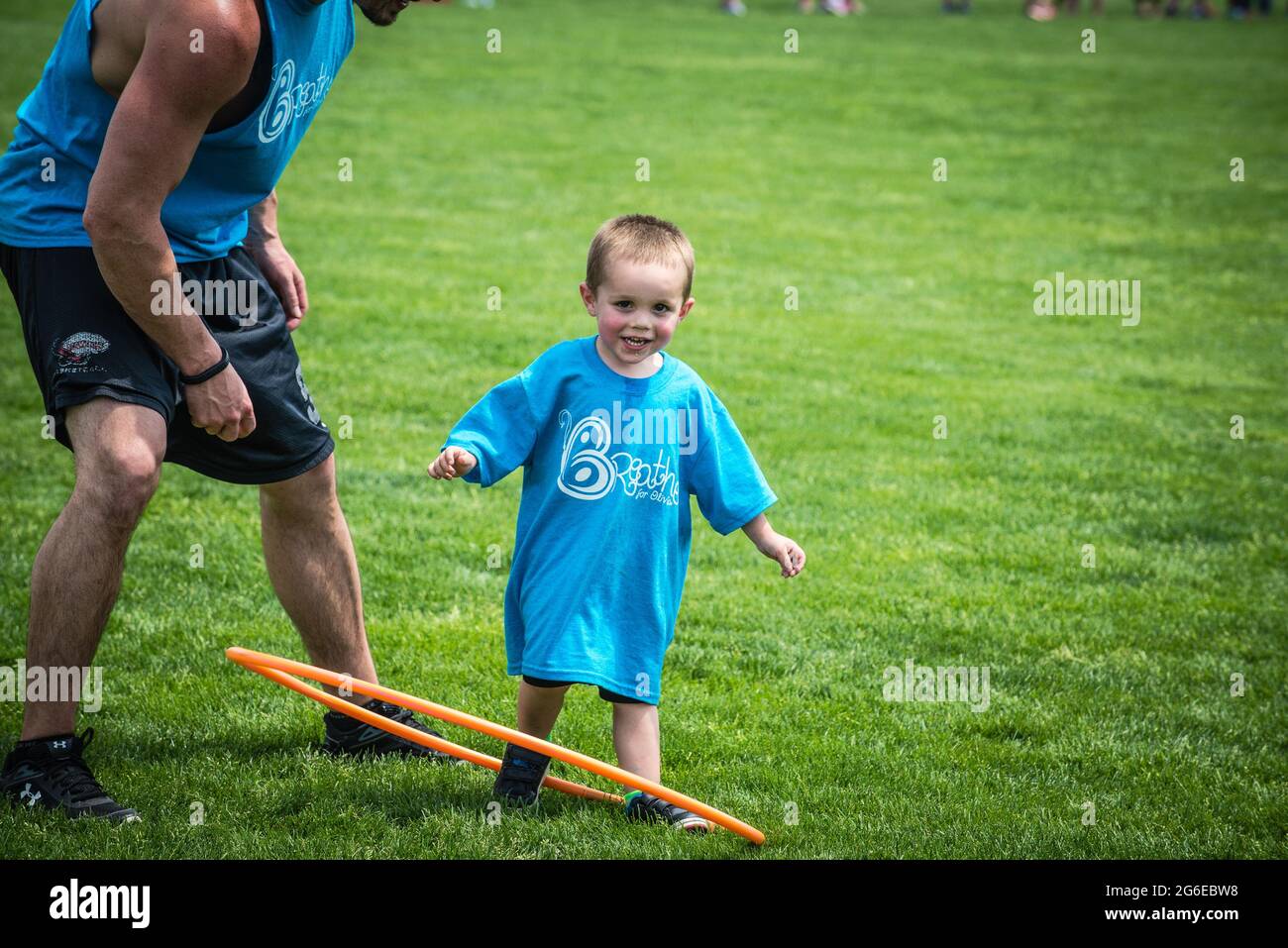Young boy with hula hoop Stock Photo - Alamy
