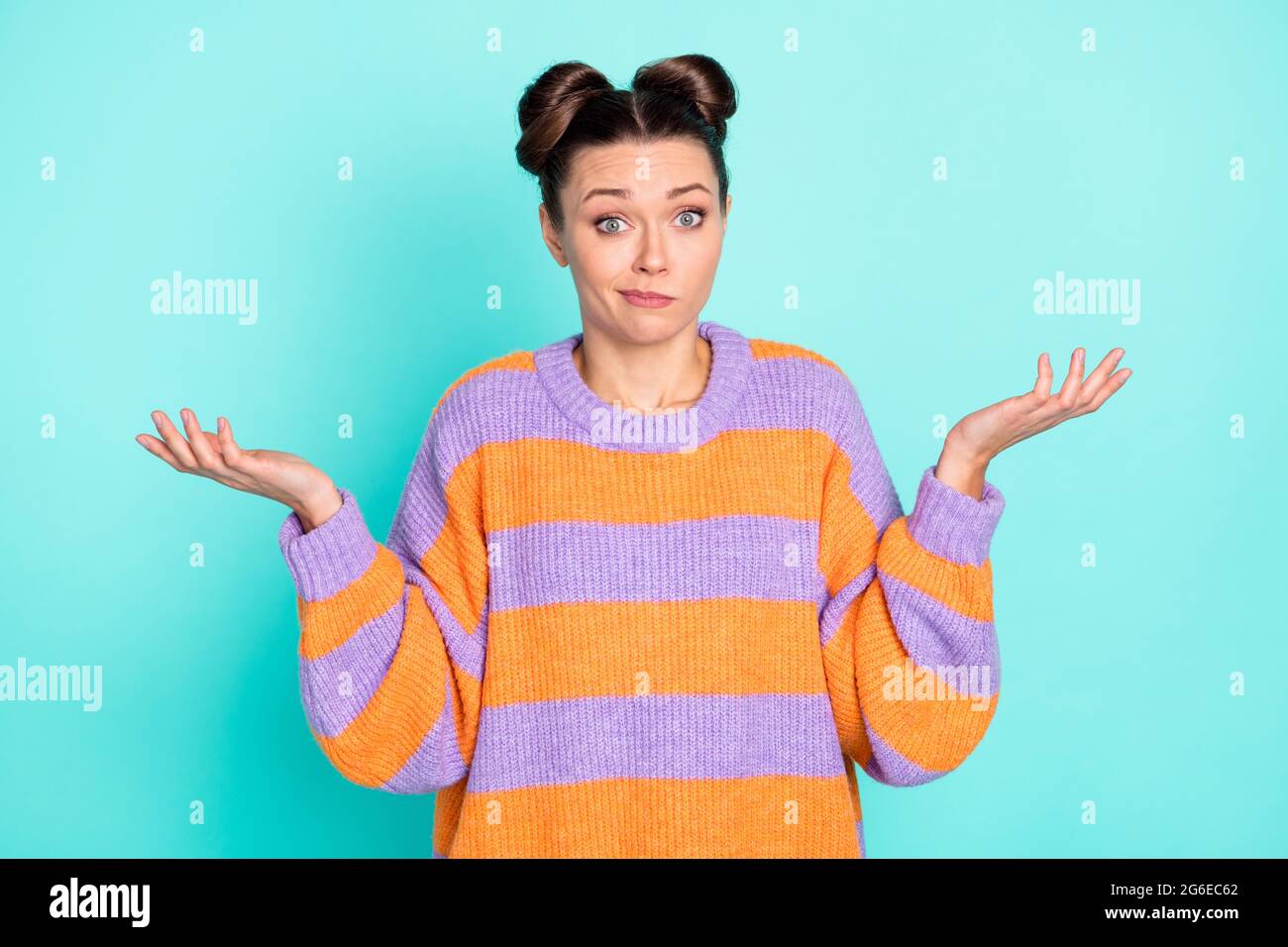 Photo of doubtful young person grimace face shrug shoulder arms sides ...