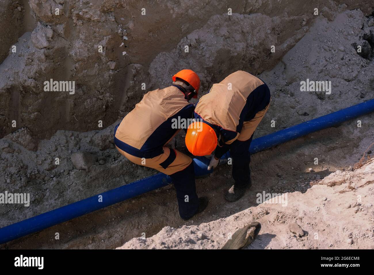 Workers are installing water supply pipeline system Stock Photo - Alamy