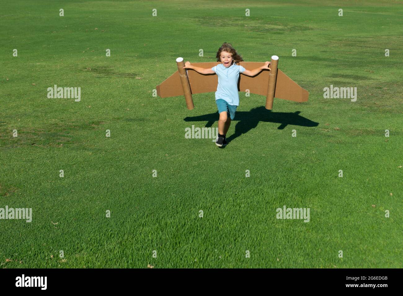 Kid imagination, child pilot with paper wings having fun at outdoor ...