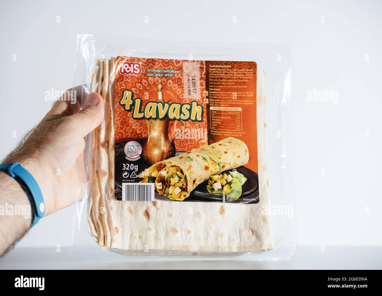 Male hand holding package with 4 lavash bread in plastic package Stock ...