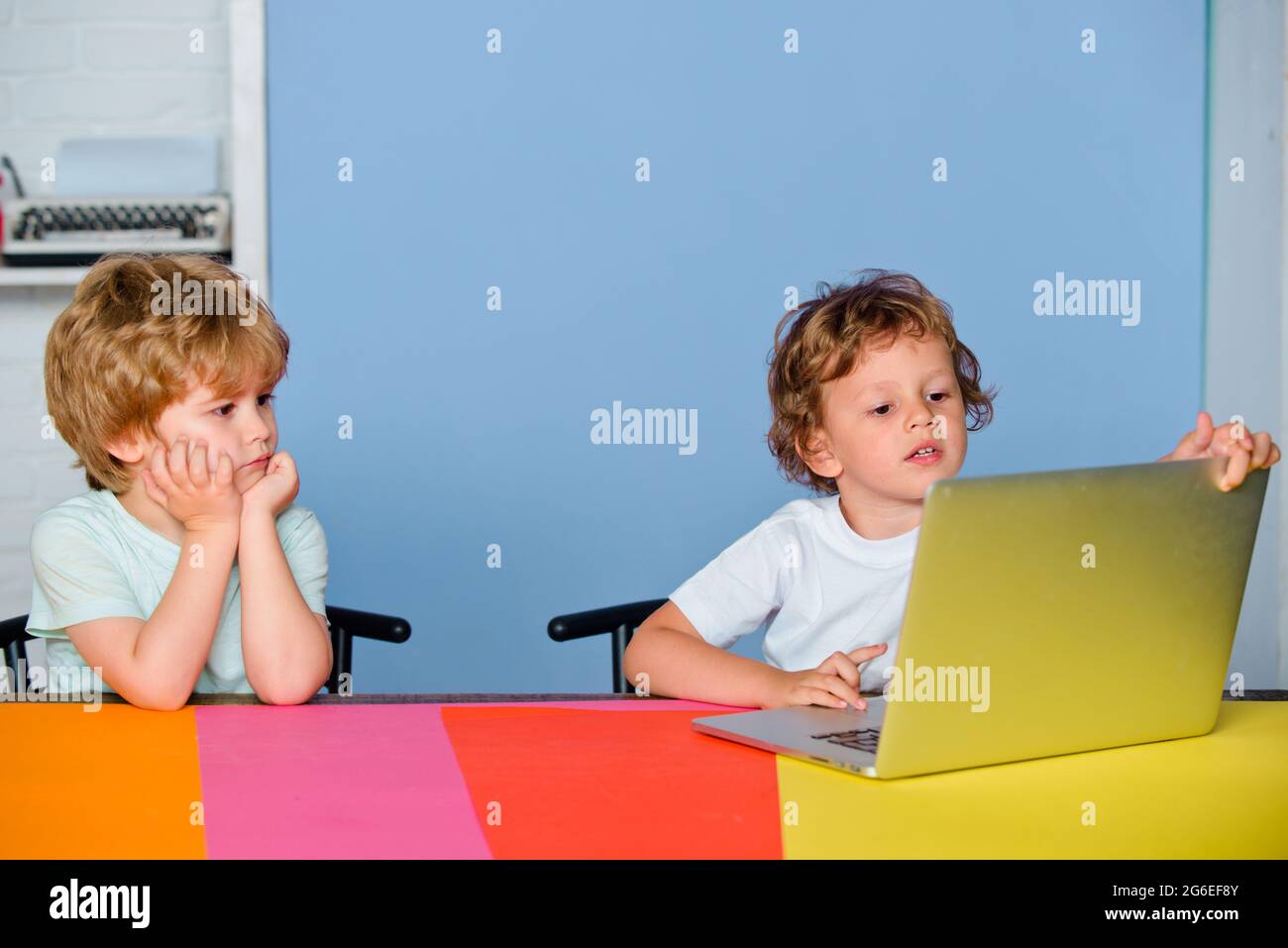 Little boys pupils with happy face expression near laptop, school ...