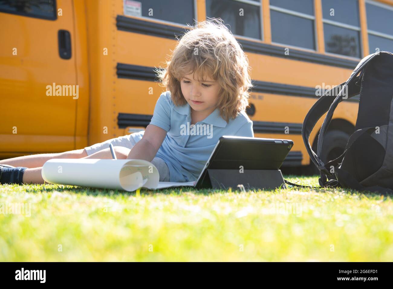 Kid study online with tablet in park. Social distance during quarantine ...