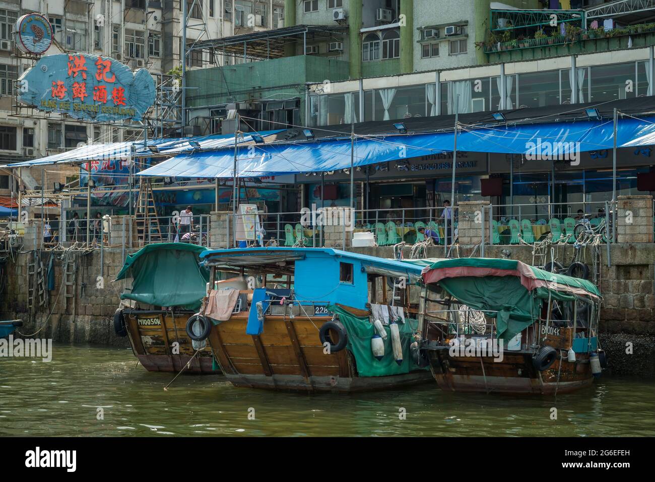 Junks used to ferry tourists to the islands of Port Shelter moored at the Sai Kung waterfront ...