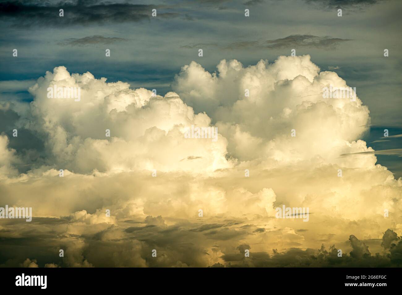 Cumulonimbus and altostratus clouds seen from a passenger jet above the ...