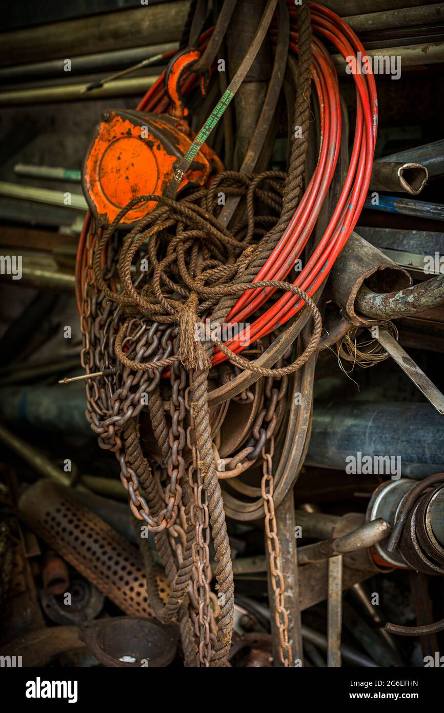 Block and chains, cables and ropes in a mechanic's workshop, Sai Kung ...