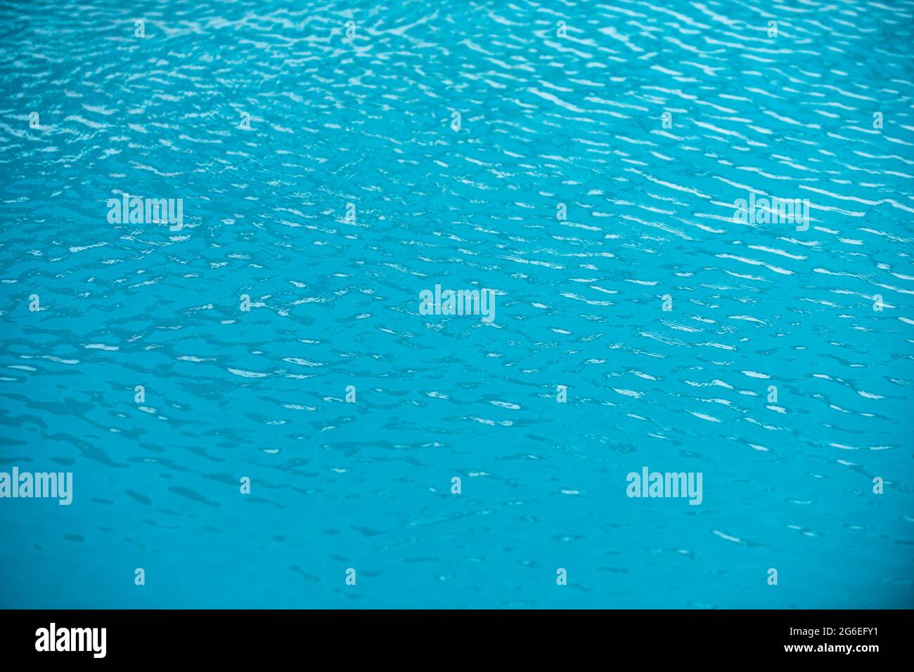 Ripped water in swimming pool. Surface of blue swimming pool ...