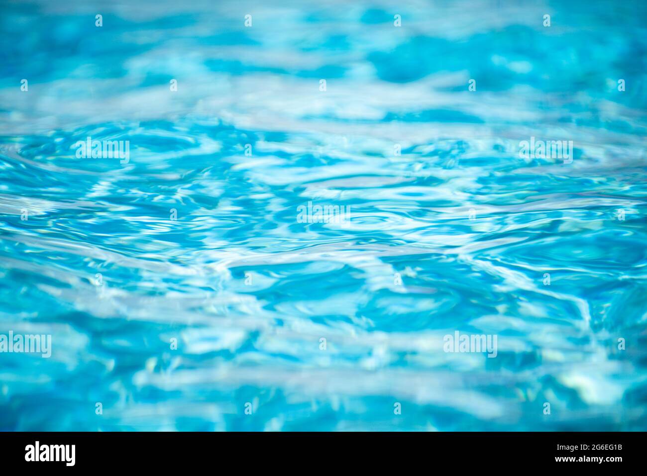 Background of blue water in swimming pool with sun reflection, ripple ...