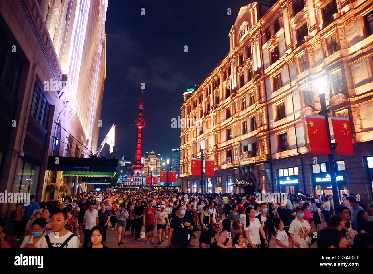 SHANGHAI, CHINA - JULY 3, 2021 - Visitors visit the Shanghai Bund and ...