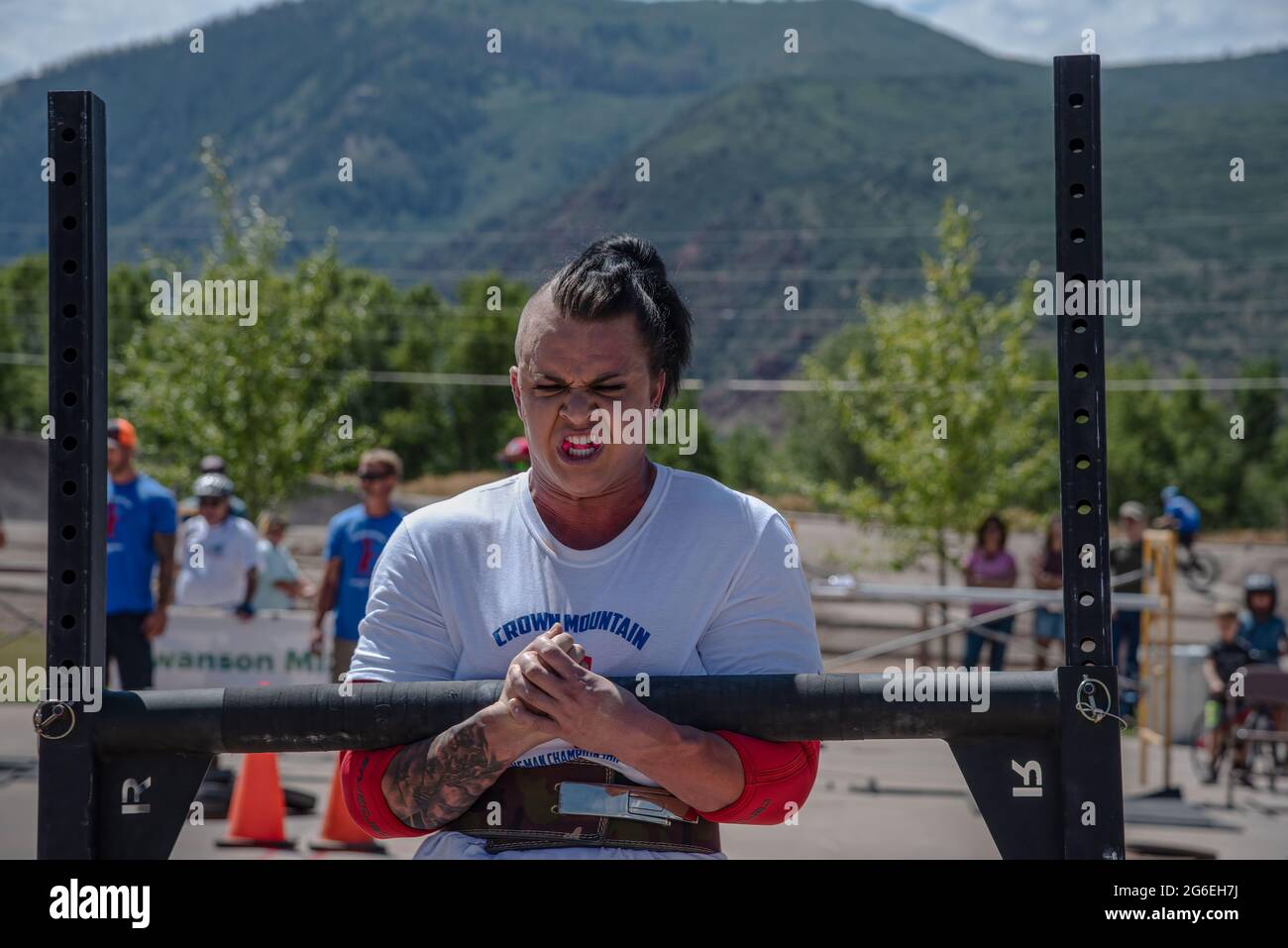 A woman competes in the Zercher carry at the Crown Mountain Strongman ...