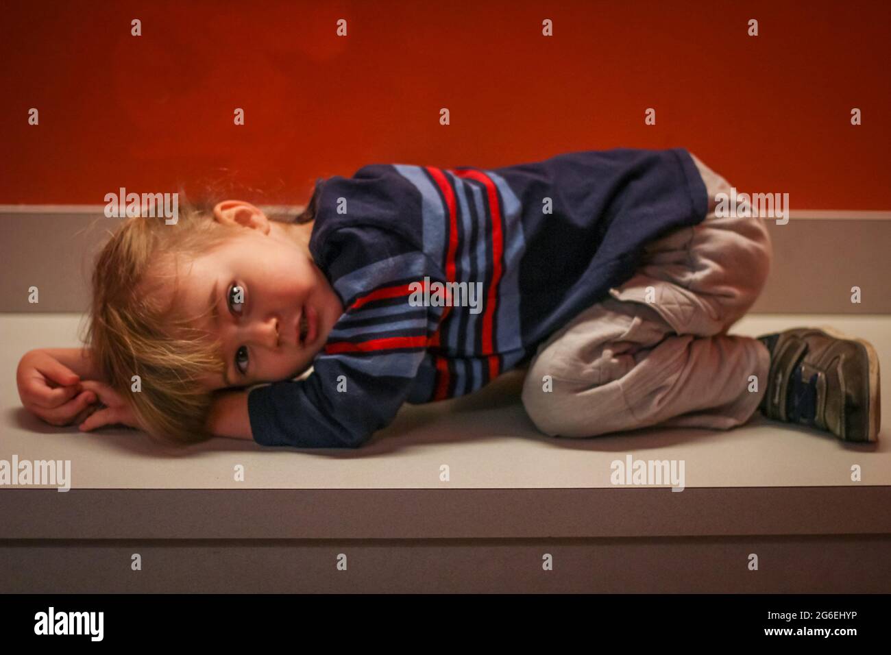 baby boy with red background Stock Photo - Alamy