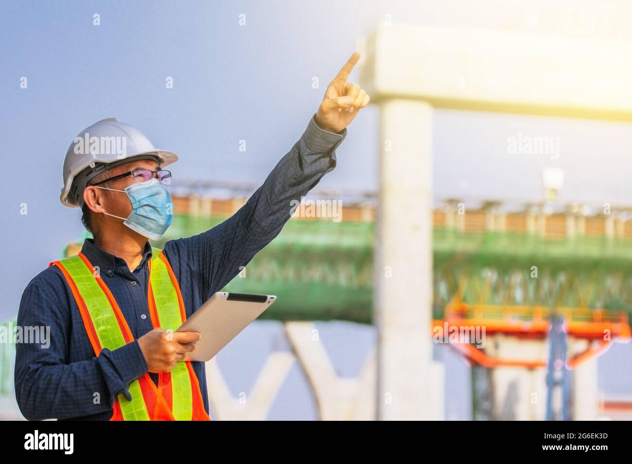 Engineer hold tablet working site construction Stock Photo - Alamy